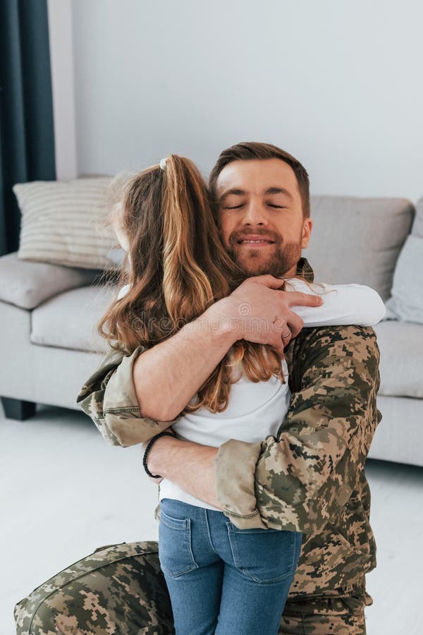 Finally at Home. Soldier in Uniform is with His Little Daughter Stock ...