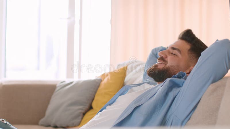 Finally Rest. Young Happy Middle Eastern Guy Falling Down on Sofa and ...