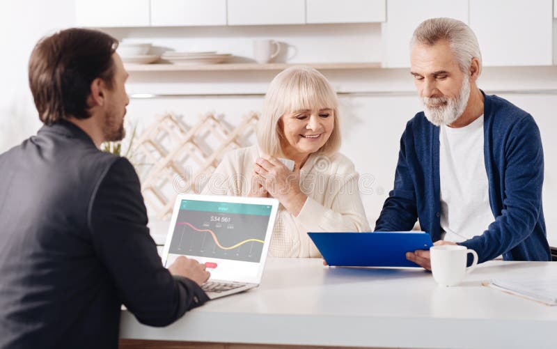 Finance Advisor Working with Aged Couple in the House Stock Photo ...