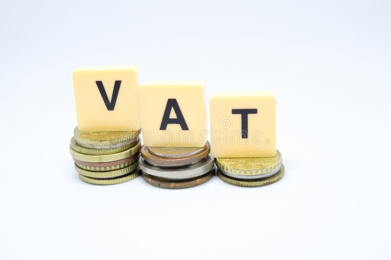 Finance Concept with Stack of Coins - VAT Value Added Tax Written on ...