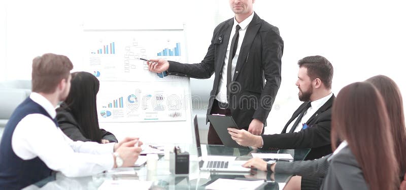 Finance Manager Pointing a Marker on the Flipchart with Financial Data ...