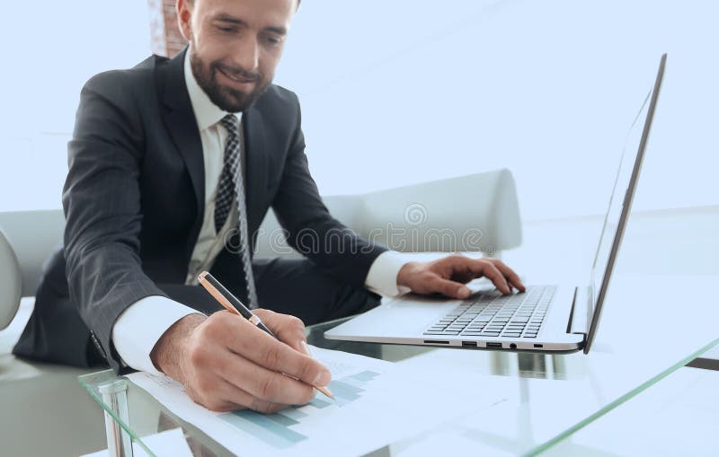 Finance Manager Working with Business Graphics on a Laptop Stock Photo ...