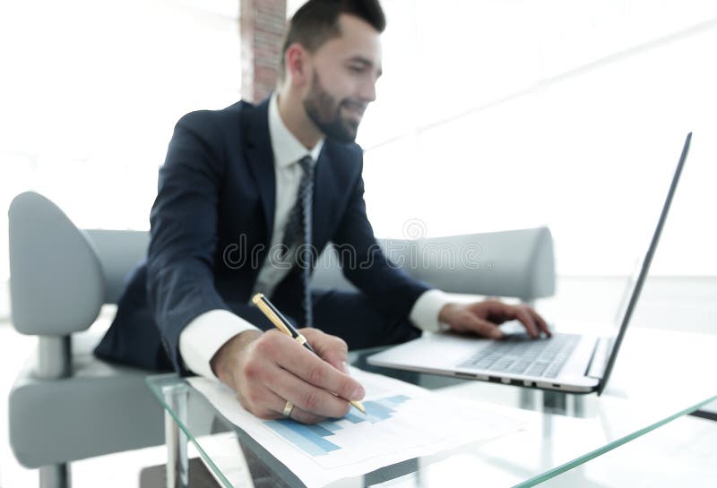 Finance Manager Working with Business Graphics on a Laptop Stock Photo ...