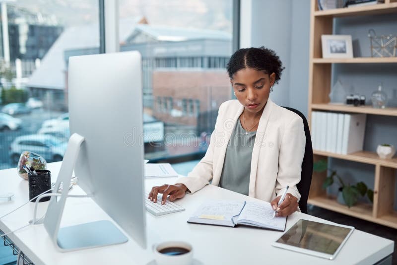 Finance Manager Writing Notes, Typing on a Computer Keyboard and ...