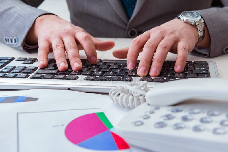 The Finance Professional Working on Keyboard with Reports Stock Image ...