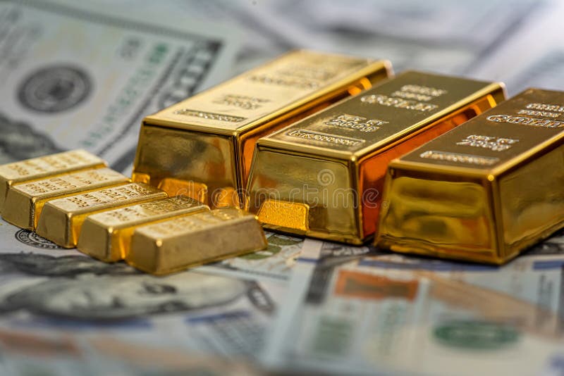 Finance Investment Concept of Gold Bars on the 100 US Dollars Banknote ...