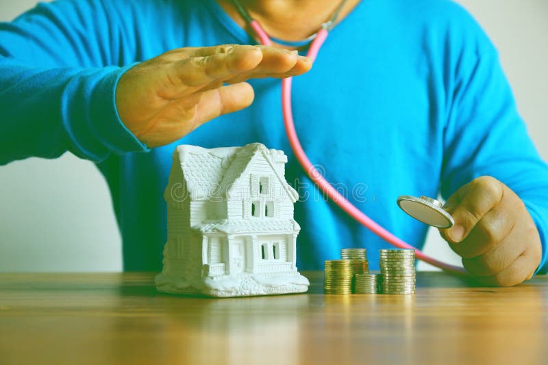 Financer Using Stethoscope Showing Idea Home and Money Security Protect ...