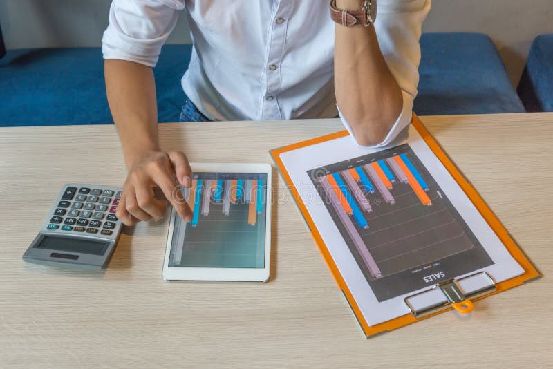 Close Up of Hand Using Tablet and Analyzing Sales Chart Stock Image ...