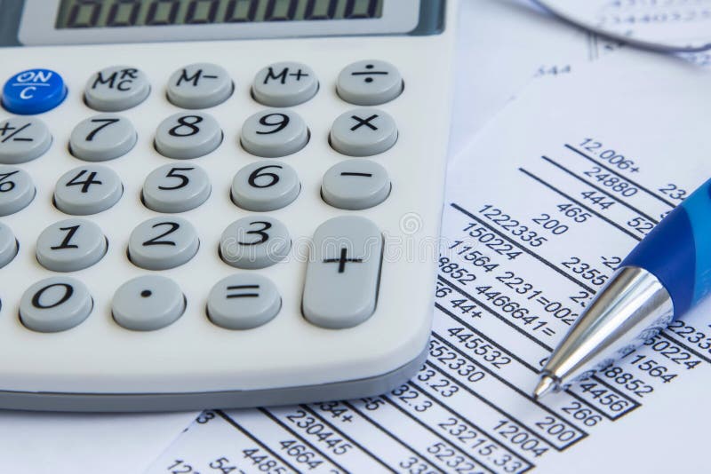 Financial Accounting with Paper Reports and Calculator Stock Image ...