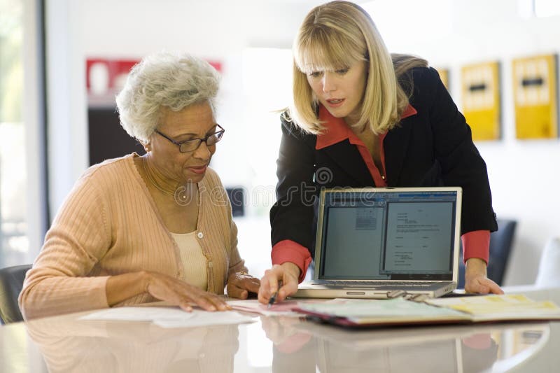 Financial Advisor Assisting Senior Woman Stock Photo - Image of adult ...
