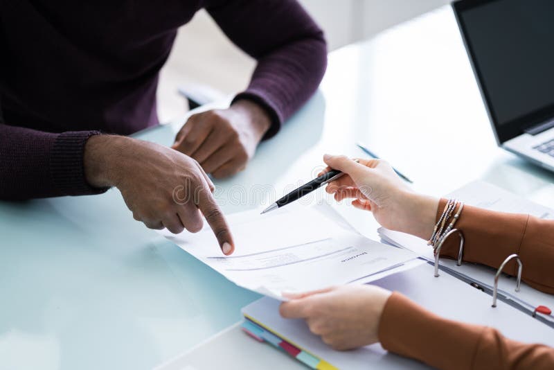 Financial Advisor Discussing Invoice with Her Client Stock Image ...