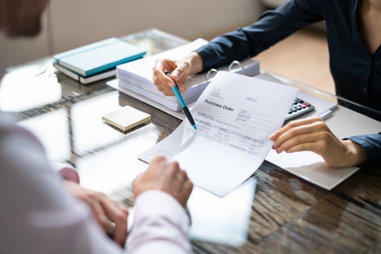 Financial Advisor Discussing Invoice with Her Client Stock Photo ...