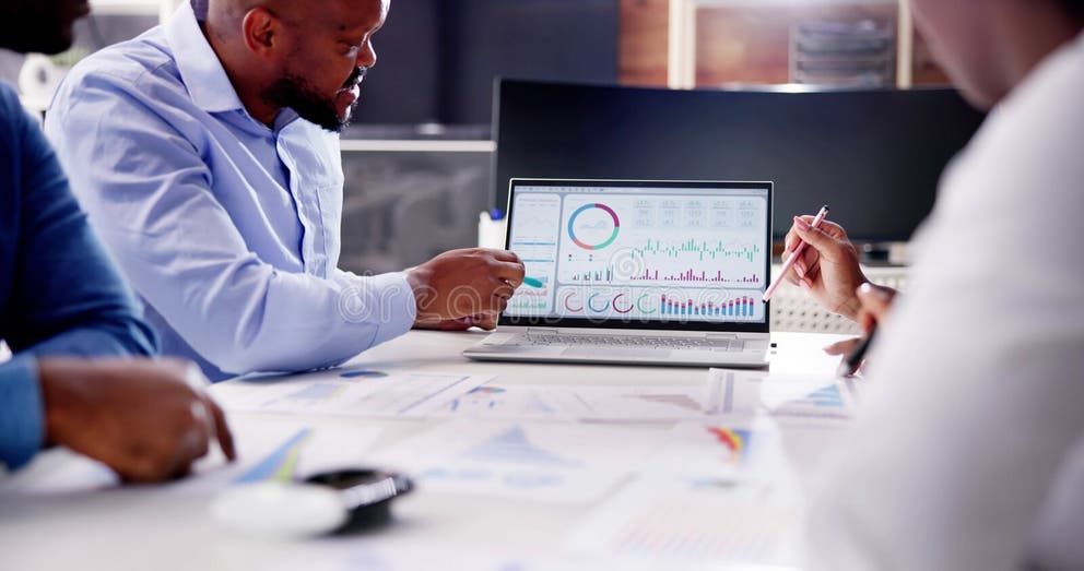 Financial Advisor Group Meeting Examining Analytics Stock Image - Image ...