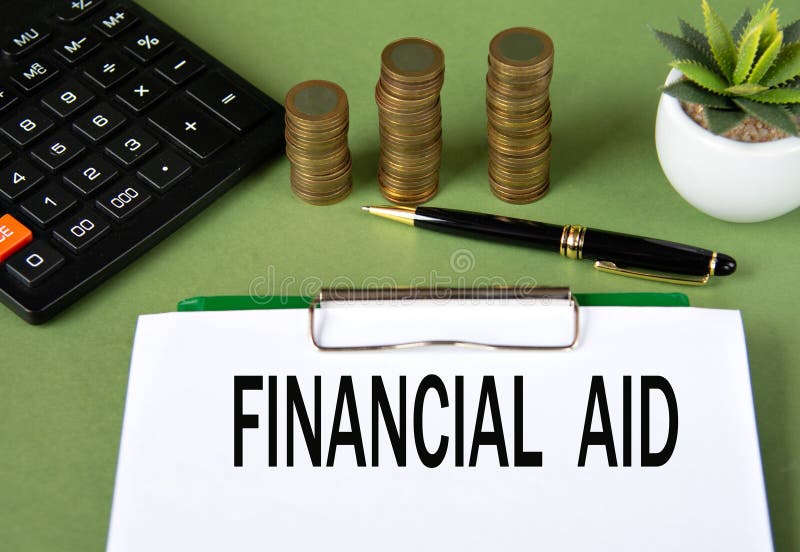 FINANCIAL AID - Words on a White Sheet with a Calculator and Stacks of ...