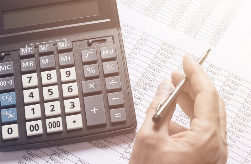 Financial Analysis Concept, Male Hand with Pen Using a Calculator Over ...