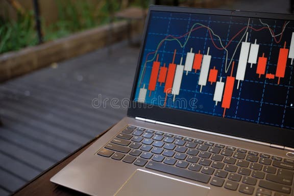 Financial Analysis, View of a Laptop and Keyboard with Candlestick ...