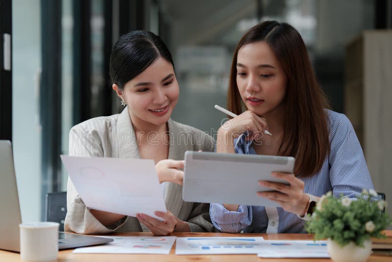 Financial Analyst Discussing with Investment Banker at Meeting Room ... Financial Analyst Discussing with Investment Banker at Meeting Room ...