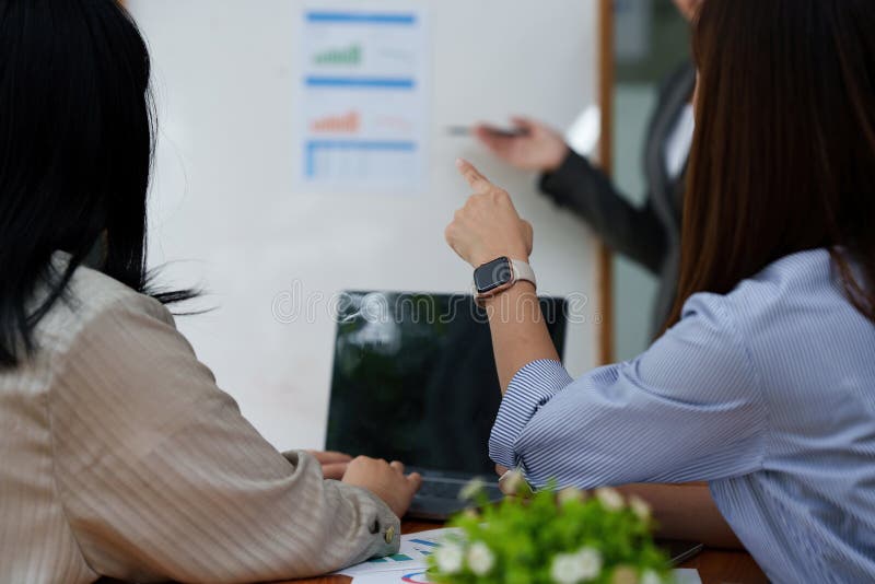 Financial Analyst Discussing with Investment Banker at Meeting Room ... Financial Analyst Discussing with Investment Banker at Meeting Room ...