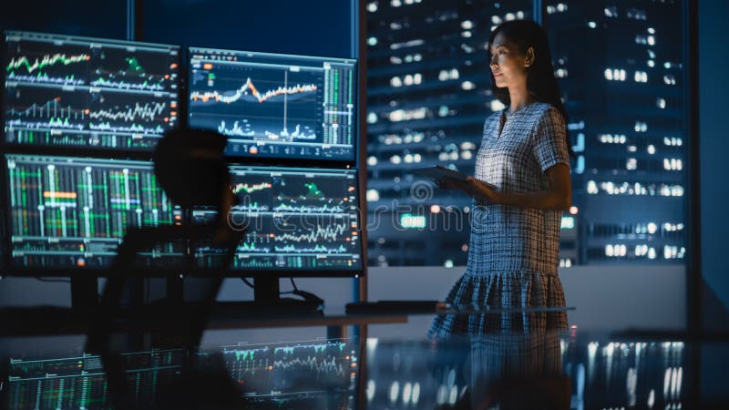 Financial Analyst Working on Computer with Multi-Monitor Workstation ...