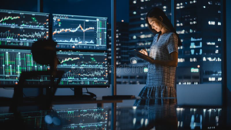 Financial Analyst Working on Computer with Multi-Monitor Workstation ...