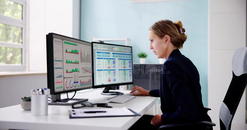 Analyst Working with Multiple Monitors in Modern Office Stock Photo ...