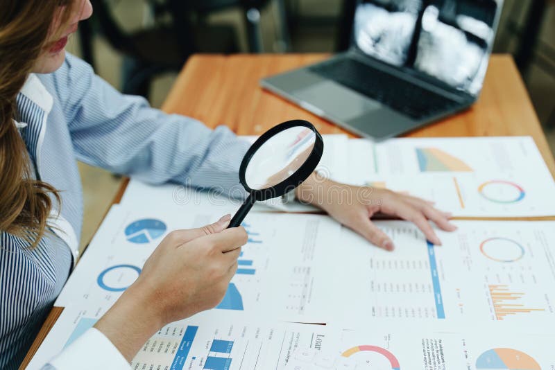 Woman Magnifying Glass Examining Documents Stock Photos - Free ...