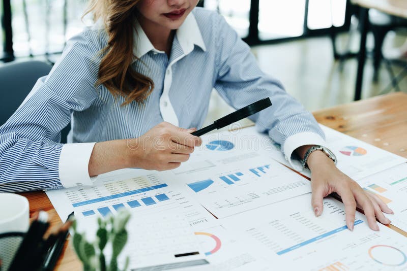 Financial Analysts Analyzing Business Financial Reports are Examining ...