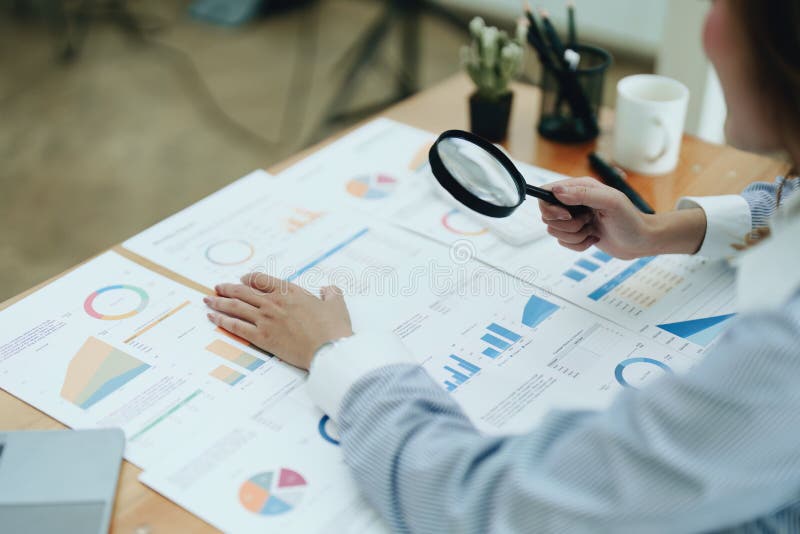 Financial Analysts Analyzing Business Financial Reports are Examining ...