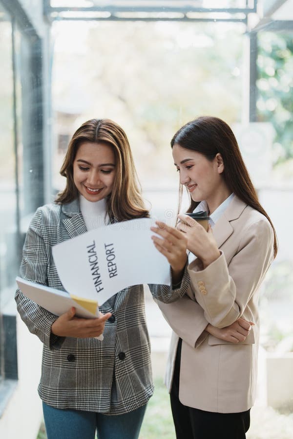 Financial Analysts Analyzing Business Reports on Planned Investment ...