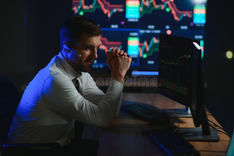 Financial Analysts and Day Traders Working on a Computers with Multi ...