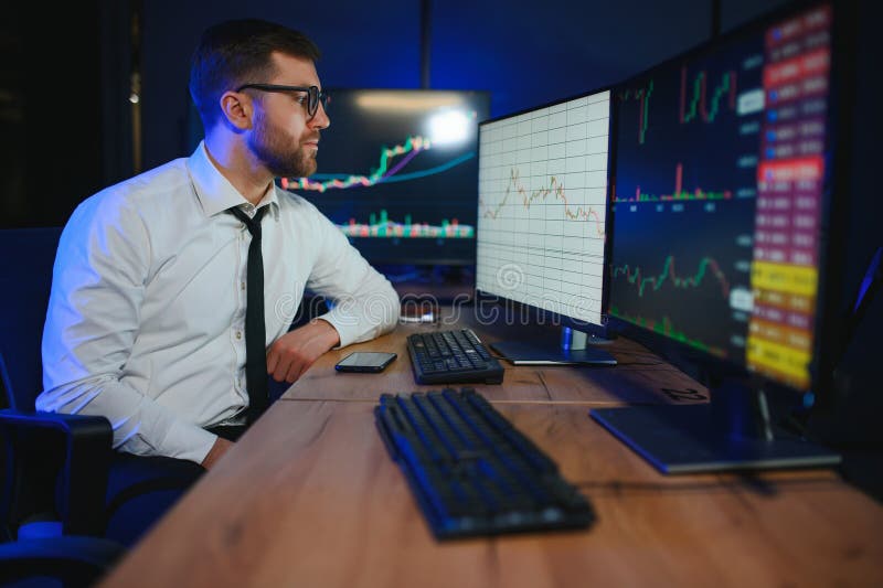 Financial Analysts and Day Traders Working on a Computers with Multi ...