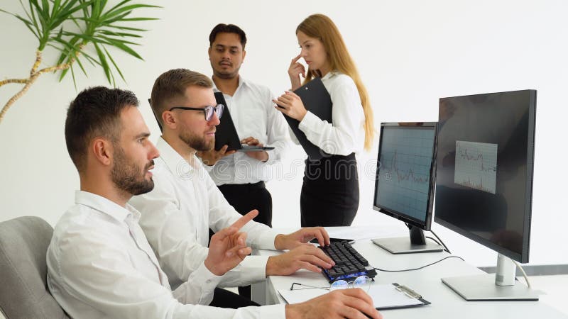 Diverse Financial Analysts and Day Traders Working on a Computers with ...