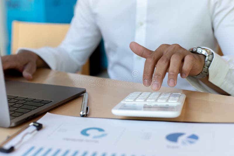 A Financial Businessman, a Young Man Analyzes Financial Data Using a ...