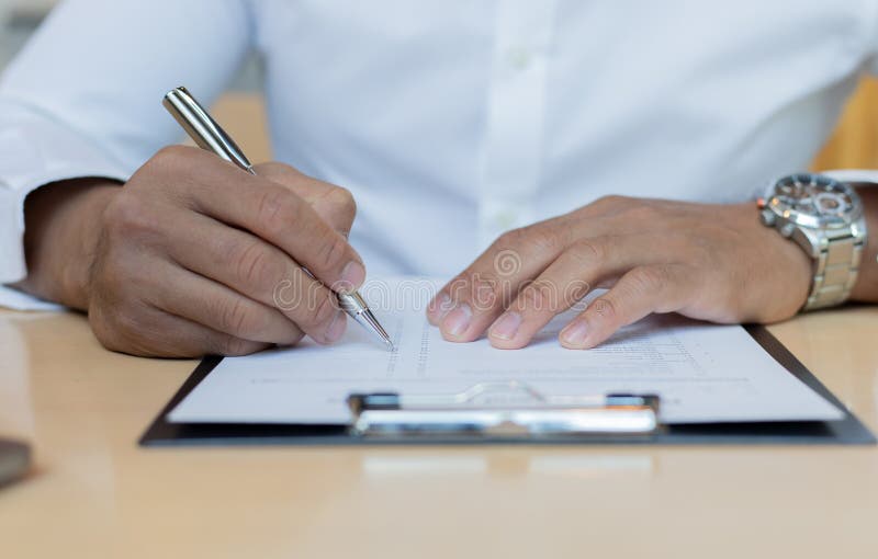 A Financial Businessman, a Young Man Analyzes Financial Data Using a ...