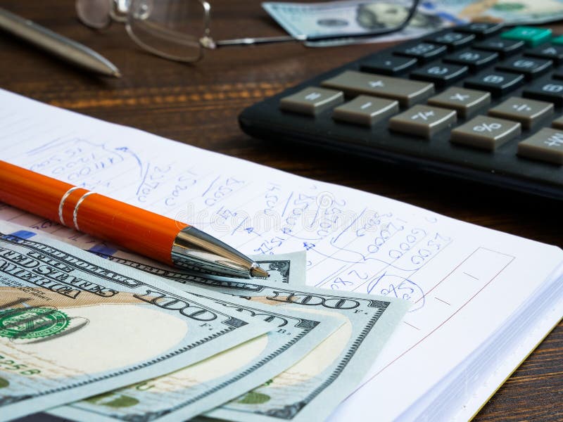 Financial Calculations Written by Hand in Notebook, Dollars and a ...