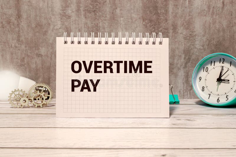 Financial Concept about OVERTIME PAY with Sign on the Sheet Stock Photo ...