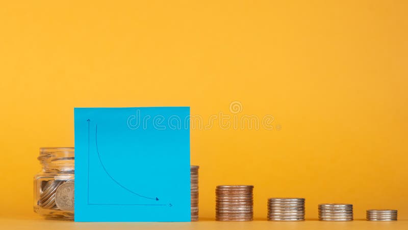 Financial Crisis. Pile of Coins with a Graph for a Fall Stock Photo ...