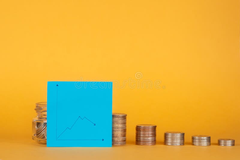 Financial Crisis. Pile of Coins with a Graph for a Fall Stock Photo ...