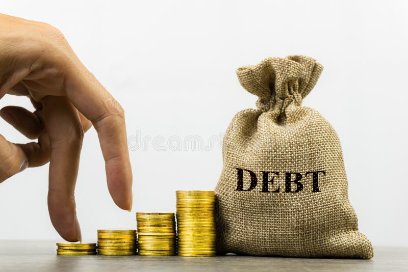 Financial Debt Concept. a Man Hand on Stack of Coins and Money Bag ...