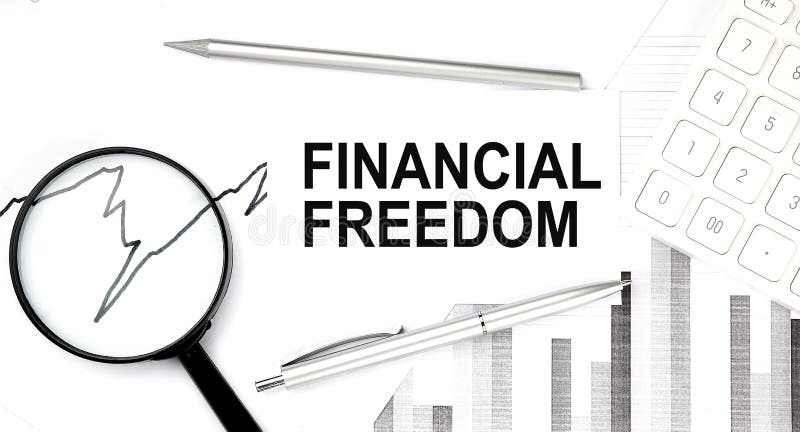 FINANCIAL FREEDOM - Document with Pen,graph and Magnifier,calculator ...