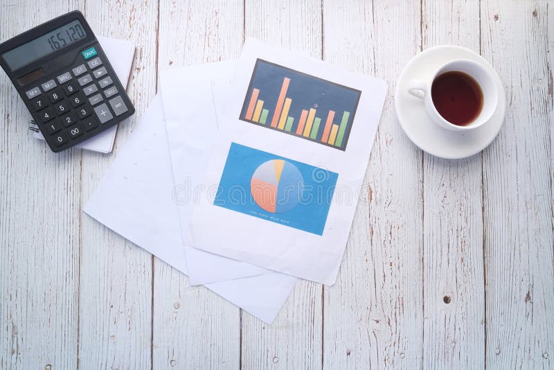 Financial Graph, Calculator and Notepad on Table Stock Image - Image of ...