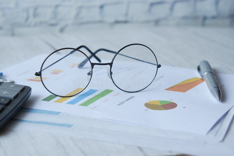 Financial Graph, Calculator and Notepad on Table Stock Image - Image of ...