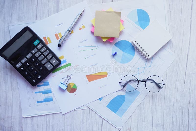 Top View of Financial Graph, Calculator and Notepad on Table Stock ...