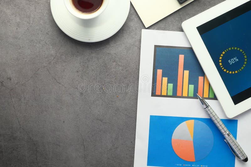 Financial Graph and Digital Tablet on Table, Using Self Created Chart ...