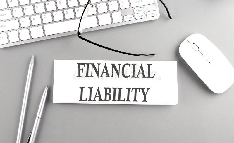 FINANCIAL LIABILITY Text on Paper with Keyboard on Grey Background Stock Photo - Image of report ...