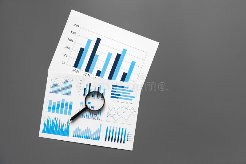 Financial Paper with Charts and Diagrams on Gray Table Stock Photo ...