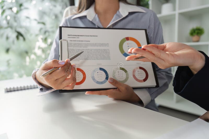 Financial Professionals Analyzing Data and Discussing Strategies in a ...