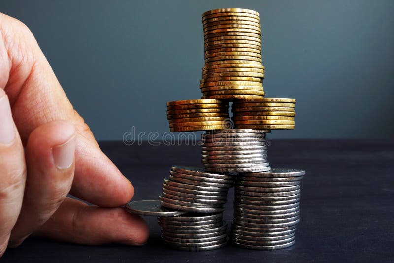 Financial Stability. Man Holding Coin in the Coins Stack. Stock Image ...