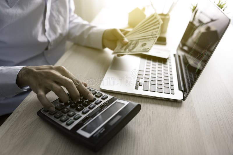 Financial Staff Using a Calculator Stock Photo - Image of concept ...