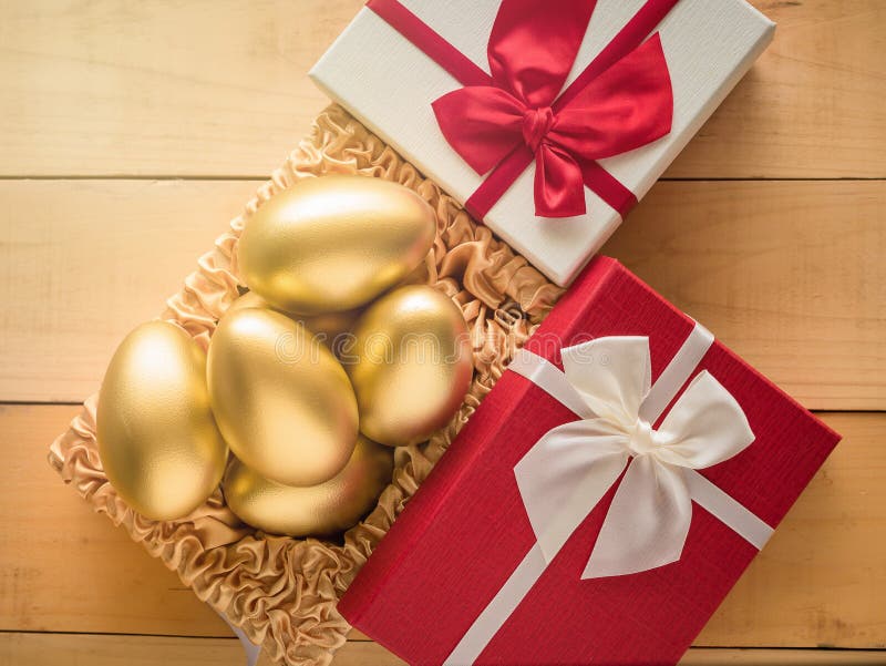 Financial Success. Golden Egg in a Red Gift Box Stock Photo - Image of ...